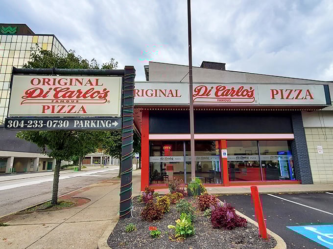A slice of Americana! DiCarlo's iconic red and white storefront beckons pizza lovers like a siren song for the taste buds.