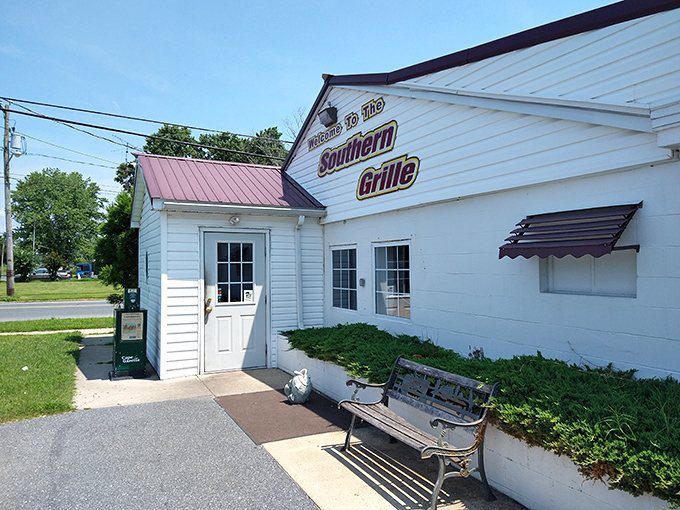 The unassuming white exterior with its bold "FOOD" flag is like a secret handshake among locals who know where real flavor lives.