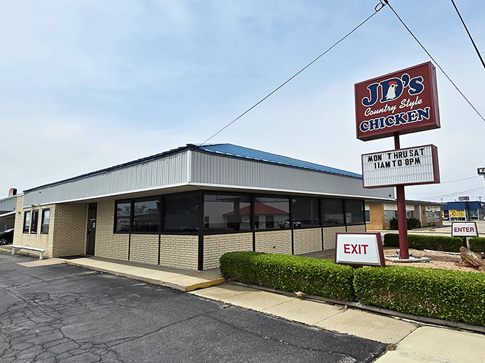The iconic red JD's sign beckons hungry travelers like a lighthouse for the famished. Simple exterior, extraordinary food&mdash;the best kind of Midwest promise.