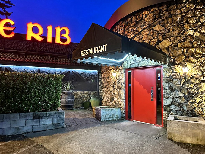 A beacon of beefy bliss! Clyde's neon sign promises prime rib paradise, while its Tudor-style exterior whispers of old-world charm.