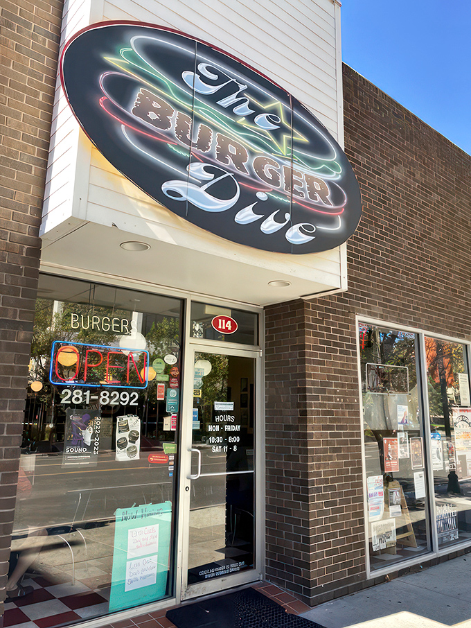 Step into burger paradise! The Burger Dive's retro neon sign beckons, while a majestic bison mural keeps watch. It's like a time-traveling foodie's dream come true.