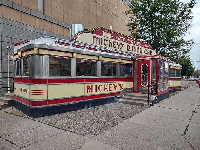 A slice of Americana on wheels! Mickey's Diner, a gleaming Art Deco treasure, stands proudly amid St. Paul's skyline, promising comfort food and nostalgia in equal measure.
