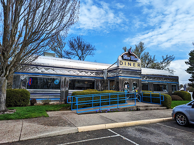 Step into a time machine disguised as a diner! The Blue Moon's gleaming exterior promises a journey back to the golden age of American cuisine.