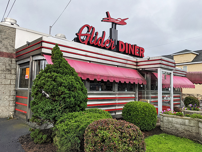 Welcome to the Glider Diner, where nostalgia meets neon! This retro gem's exterior is like a time machine with a side of fries.
