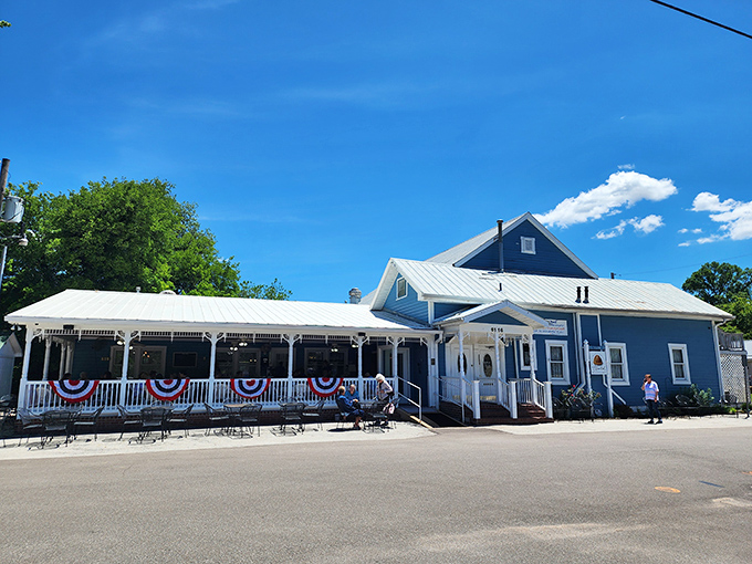 The storybook blue exterior with white trim beckons like a mirage in the Missouri countryside. No filter needed&mdash;this is pure small-town charm at its finest.