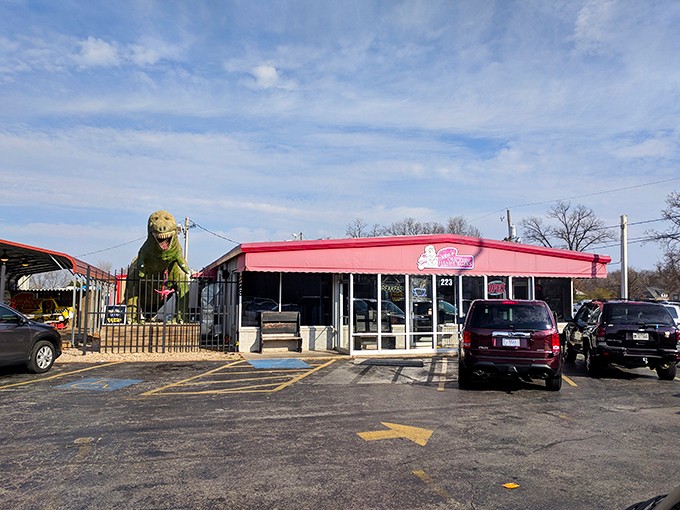 Look for the dinosaur! Sam's Olde Tyme Hamburgers & Barbecue announces its presence with prehistoric flair, promising adventures in comfort food.