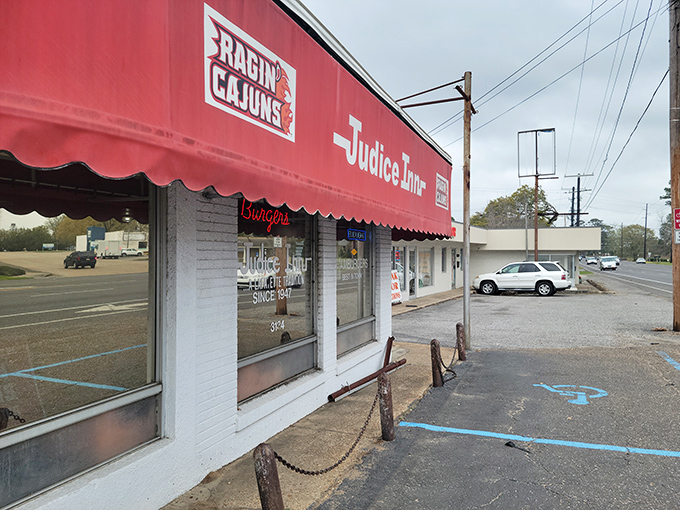 A beacon of burger bliss! Judice Inn's iconic red awning promises a journey back to simpler, tastier times.