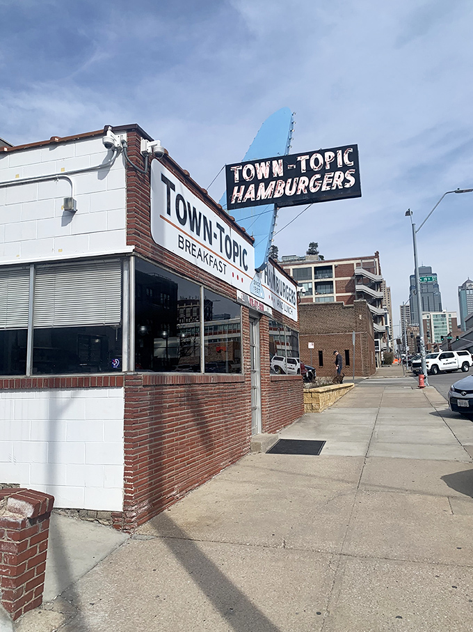 Step back in time! Town Topic's iconic sign beckons like a neon-lit lighthouse, guiding hungry souls to burger nirvana.