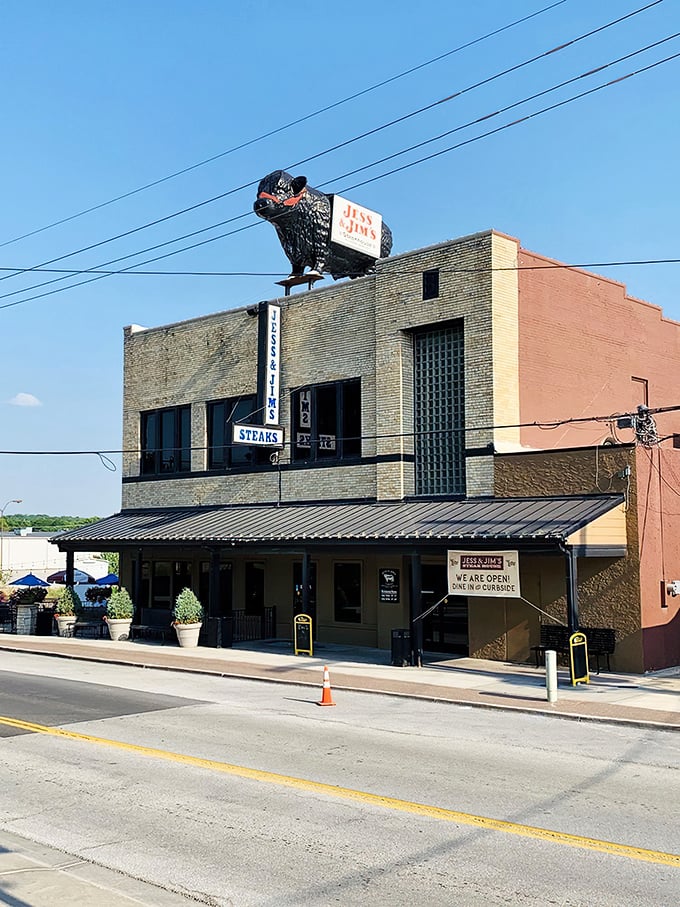 The unassuming brick exterior of Jess & Jim's Steakhouse stands as Kansas City's culinary secret hiding in plain sight, complete with vintage signage that's weathered decades.
