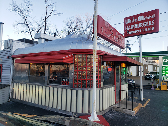 Neon dreams and burger schemes! White Manna's iconic sign beckons like a lighthouse for the hungry, guiding lost souls to slider salvation.
