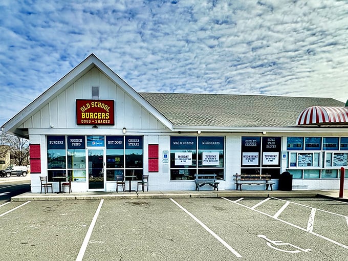 Welcome to burger paradise! Old School Burgers stands proud, its red shutters beckoning hungry travelers like a lighthouse for the famished.