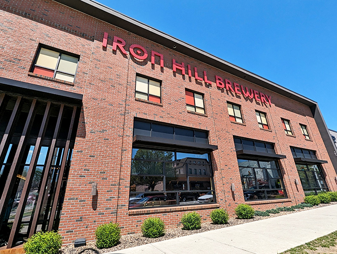 Iron Hill's brick facade glows at twilight, a beacon of craft beer and culinary promise in the heart of Hershey. Like finding an oasis after a chocolate factory tour.