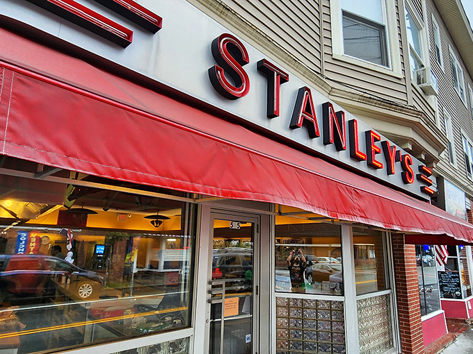 Step back in time! Stanley's iconic red awning and retro signage beckon you to a burger paradise that's been flipping patties since 1932.