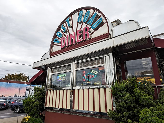 Retro chic meets modern appetite! The Post Road Diner's neon sign beckons like a lighthouse for the hungry, promising a voyage through time and taste.