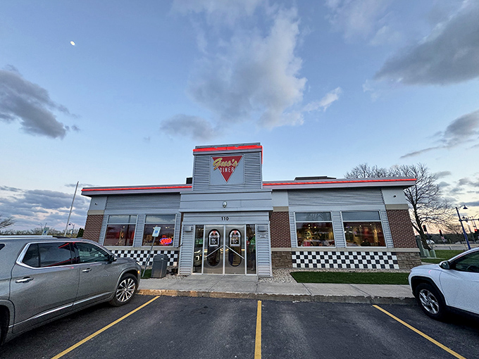 Welcome to flavor town! Gus's Diner stands proud, its red trim and checkered accents promising a feast for both eyes and stomach.