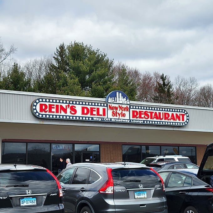 A neon beacon of deliciousness! Rein's Deli's sign promises New York-style eats that'll transport your taste buds faster than a subway ride to Manhattan