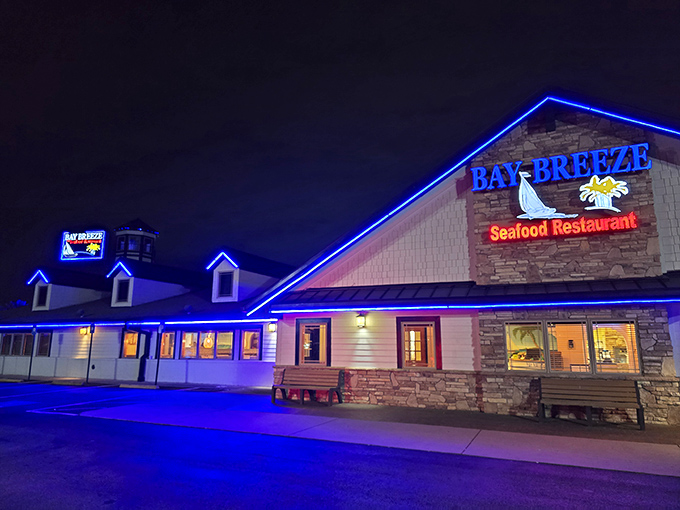 A beacon of seafood delight! Bay Breeze's neon-lit exterior promises a feast that'll have you dreaming of waves and butter sauce.