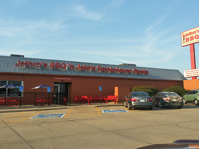 Welcome to flavor town! Jethro's BBQ 'n Jake's Smokehouse Steaks stands proud, its red-brick exterior promising a carnivore's paradise within. The aroma of slow-smoked meats practically wafts through the screen.