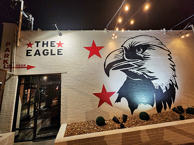 The bold eagle mural watches over this Louisville gem like a patriotic street art guardian announcing "deliciousness lives here."