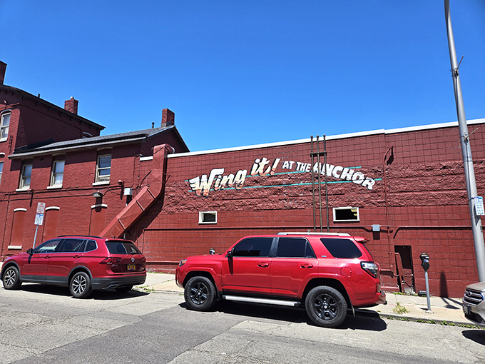 The unassuming red brick exterior of Anchor Bar proudly declares itself "Home of the Origin" &ndash; where culinary history was made one fateful night in 1964.