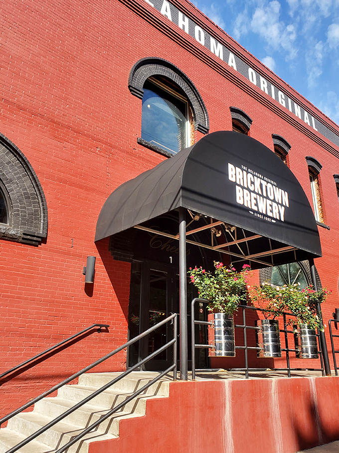 The iconic red brick exterior of Bricktown Brewery welcomes visitors. History and hops unite under one distinctive awning.