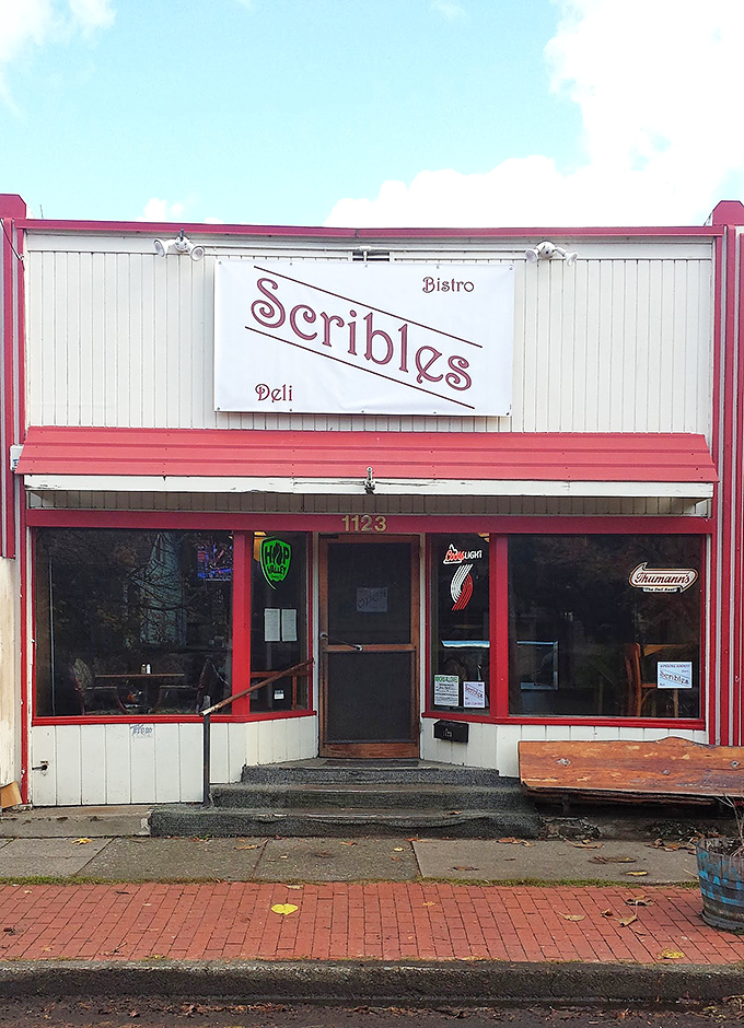 Welcome to sandwich paradise! Scribles Bistro & Deli's charming exterior promises a feast for the senses, with its inviting red trim and vintage-style sign.