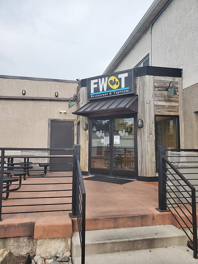 "Welcome to flavor town!" This unassuming exterior hides a world of wing-tastic delights, proving you can't judge a book by its cover – or a restaurant by its siding.