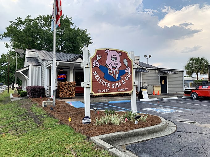 Welcome to barbecue heaven! Melvin's charming exterior, complete with a grinning pig mascot, promises smoky delights within. 