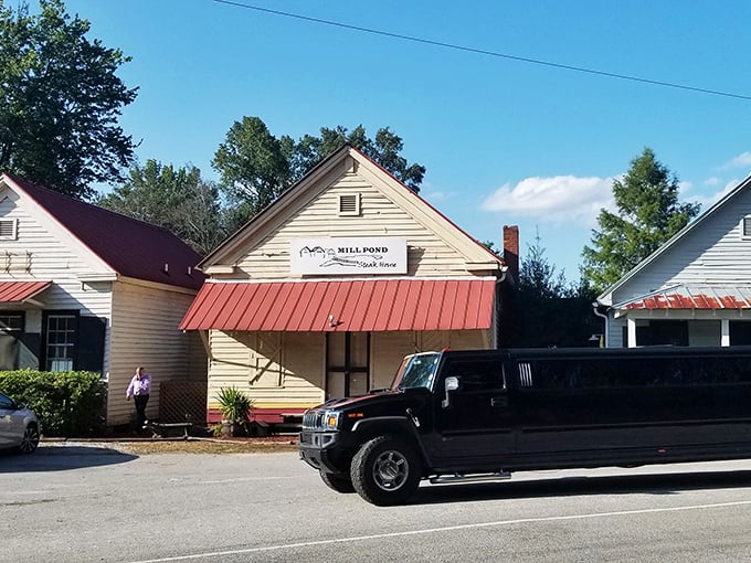 Welcome to Mill Pond Steakhouse, where the unassuming exterior hides a carnivore's paradise. It's like finding a diamond mine disguised as a cozy country cottage!