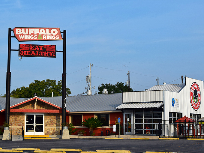 The orange and stone exterior of Wings and Rings stands proudly against the Texas sky, like a beacon calling all wing enthusiasts home.