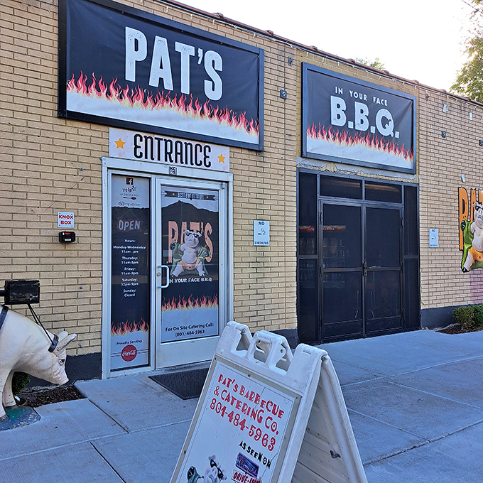 Welcome to flavor town! Pat's BBQ's exterior might be unassuming, but those flames promise a smoky paradise within.