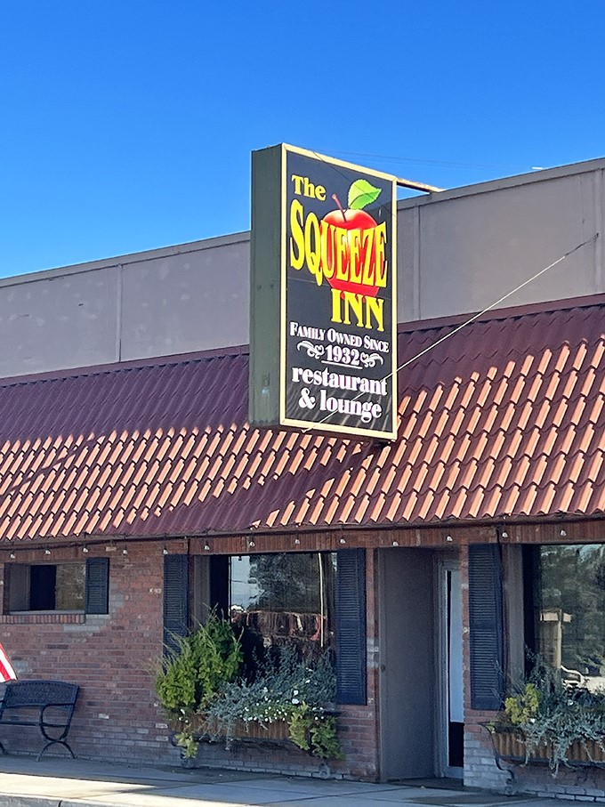 The Squeeze Inn: Where time-honored tradition meets mouthwatering steaks. This unassuming exterior hides a world of flavor waiting to be discovered.