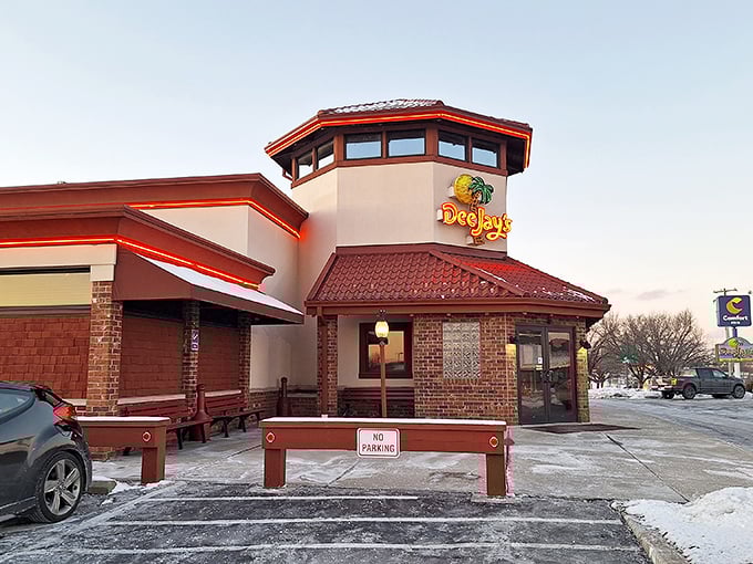 Welcome to flavor paradise! Dee Jay's exterior promises a tropical escape, complete with a palm tree logo that's more inviting than a hammock on a sunny day.