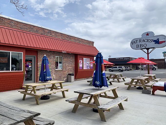 The iconic Fat Racks BBQ sign stands proud against the Wyoming sky, promising Texas-style salvation for hungry travelers.
