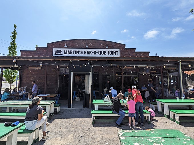 Welcome to barbecue heaven! Martin's Bar-B-Que Joint's exterior promises a smoky paradise, with string lights that beckon like a porcine Bat-Signal for meat lovers.