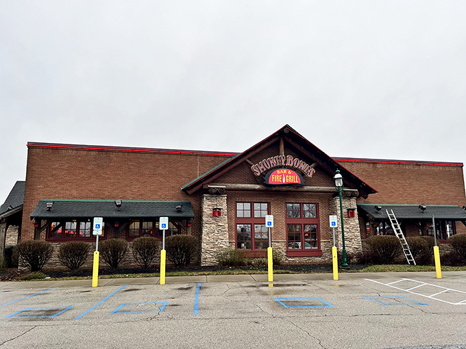 Welcome to BBQ paradise! Smokey Bones' rustic exterior promises a feast for the senses, like stumbling upon a secret mountain lodge dedicated to the art of smoke and flame.