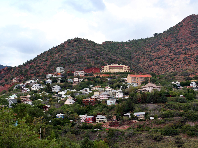 Jerome's main street: Where the Wild West meets modern charm. Vintage storefronts and parked cars create a scene that's part John Wayne, part hipster haven.
