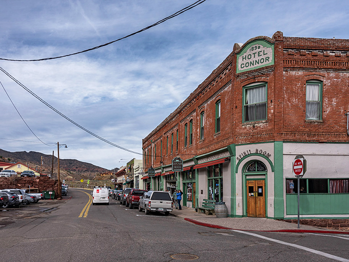 Jerome's main street: Where the Wild West meets modern charm. Vintage storefronts and parked cars create a scene that's part John Wayne, part hipster haven.