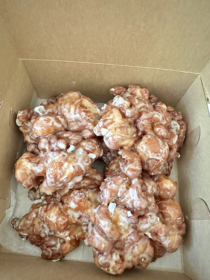 Apple fritters: where fruit meets funnel cake in a delicious dance. It's autumn's greatest hit, available year-round.