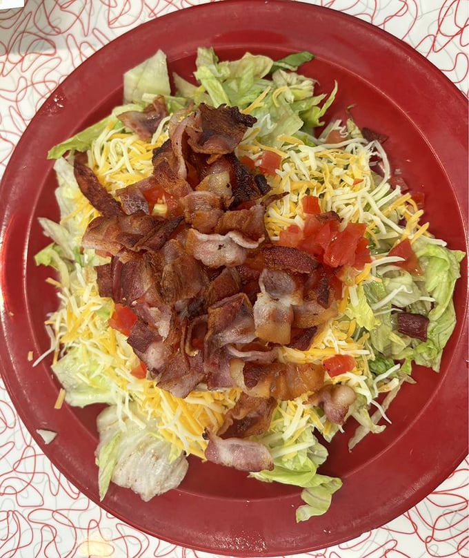 The BLT salad: where healthy meets happy. It's got more bacon than your average salad and more greens than your average BLT. Win-win!