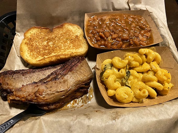 Texas meets Indiana on a tray: fork-tender brisket, beans rich enough to be an inheritance, and mac and cheese that glows like Midwestern sunshine.