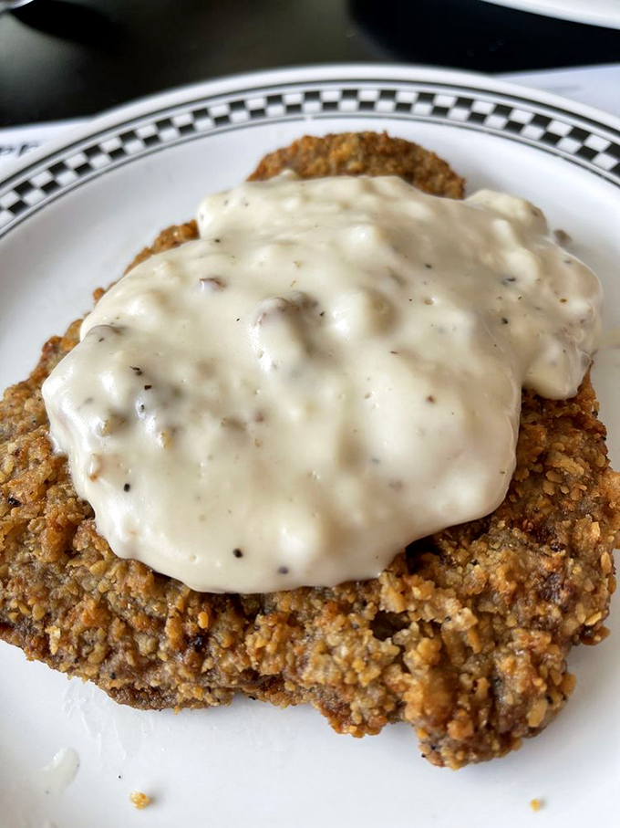 Southern comfort on a plate! This chicken fried steak is wearing a crispy jacket of happiness.