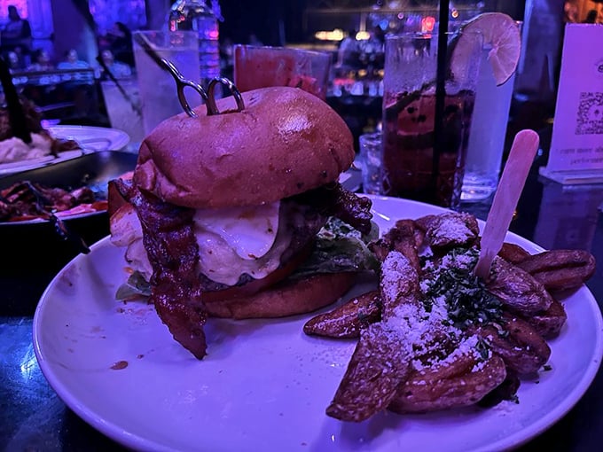 Hands off my burger! Edward Scissorhands would be jealous of this towering masterpiece. It's a delicious balancing act of flavors and textures.