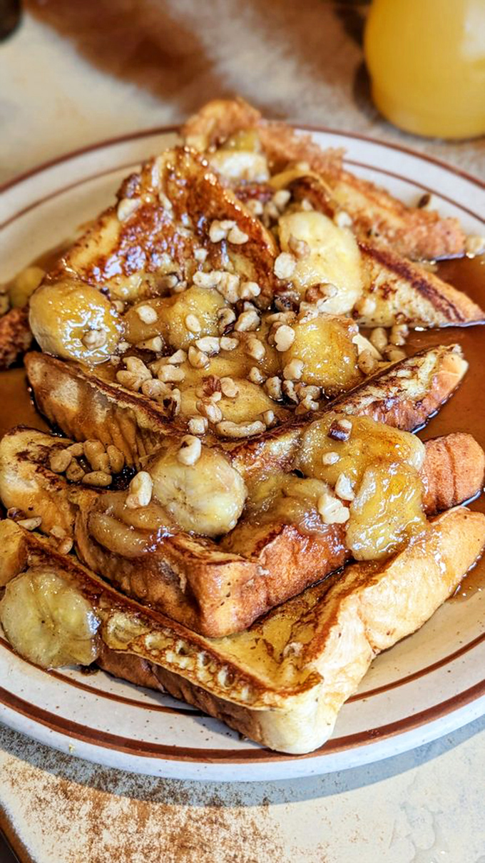 French toast that would make Marie Antoinette say, "Let them eat this instead of cake!" Topped with bananas and macadamia nuts for that island twist.
