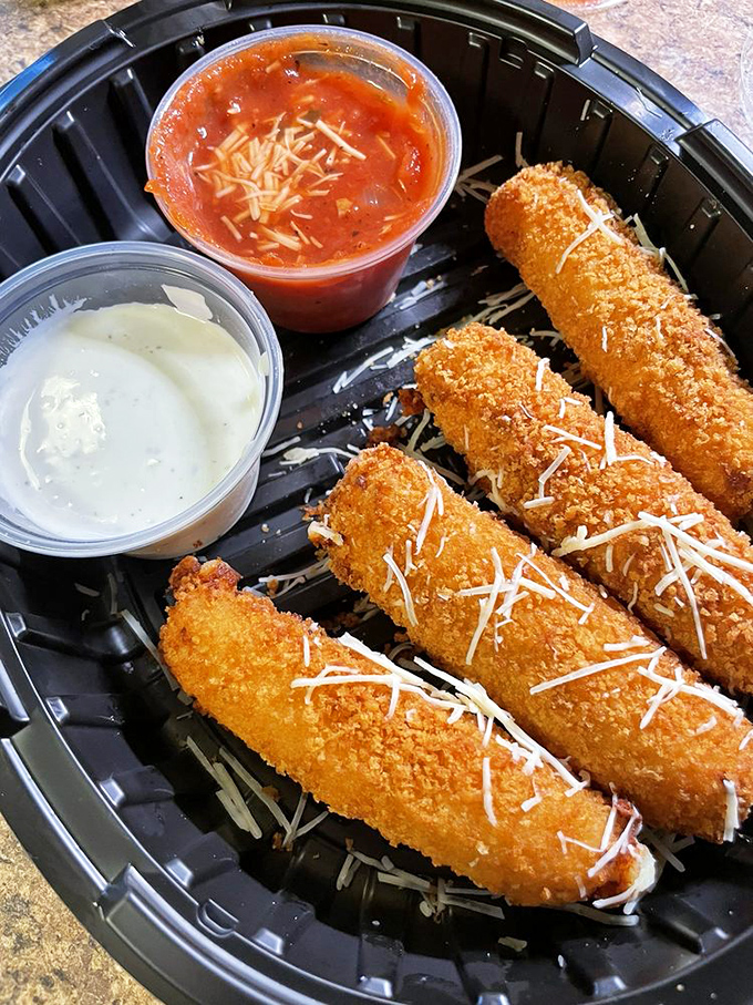 Fried mozzarella sticks with that perfect cheese pull that deserves its own slow-motion sequence in a food documentary.