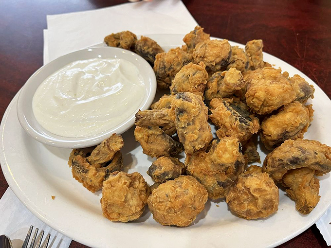 Mushroom lovers, rejoice! These golden-fried fungi are like nature's popcorn &ndash; crispy, savory, and utterly addictive. Warning: may cause spontaneous happy dances.