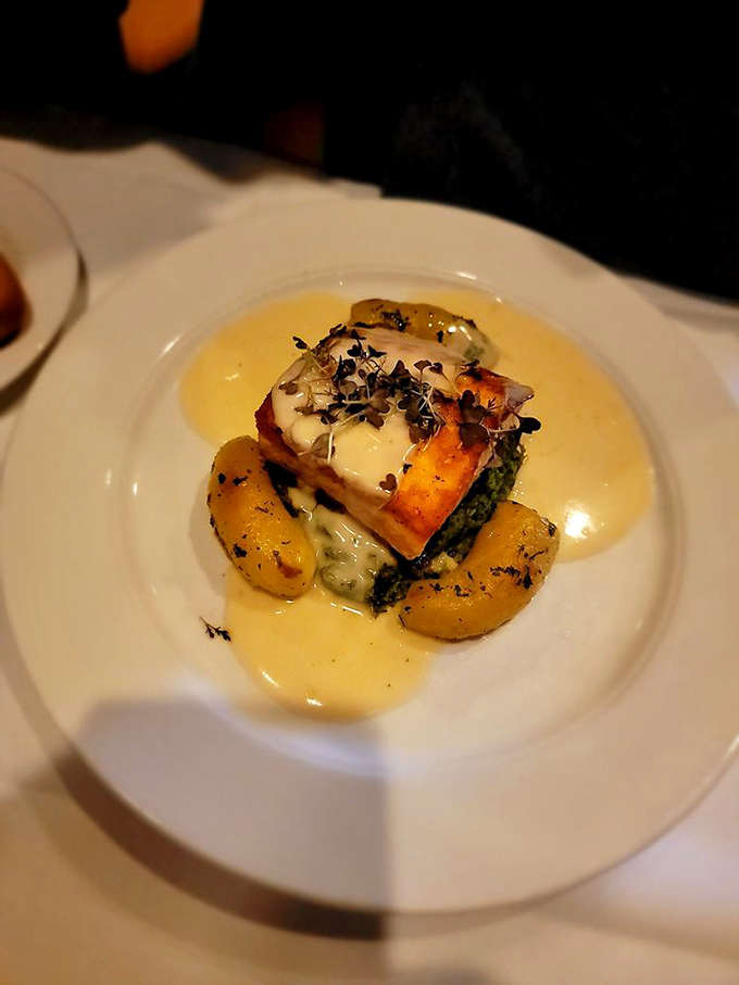 Salmon swimming in flavor! This plate is a work of art that would make Monet trade in his water lilies for a set of chef's knives.