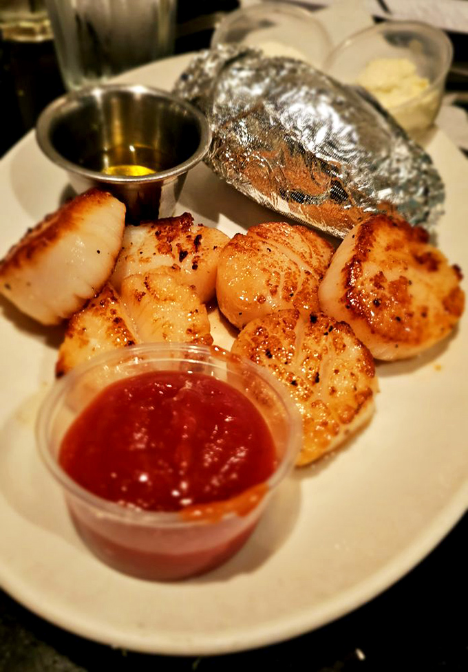 Scallops seared to perfection &ndash; it's like the sun kissed each one goodbye before sending it to your plate.