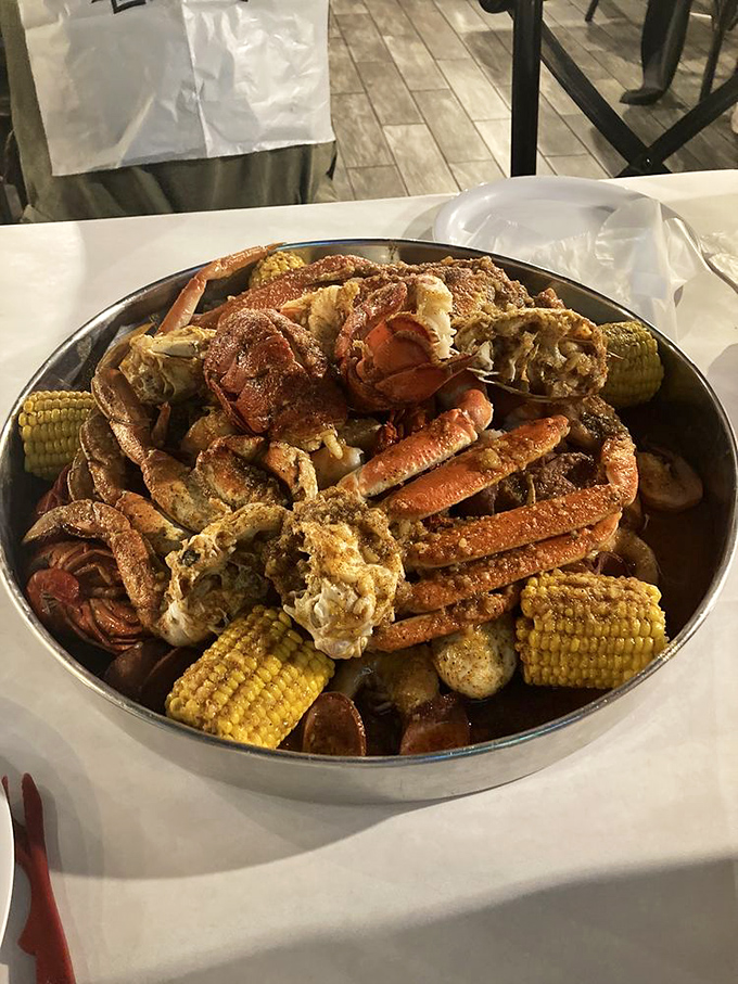 Behold, the seafood motherlode! This platter's got more legs than an octopus convention. Butter up, folks &ndash; it's time to get crackin'!