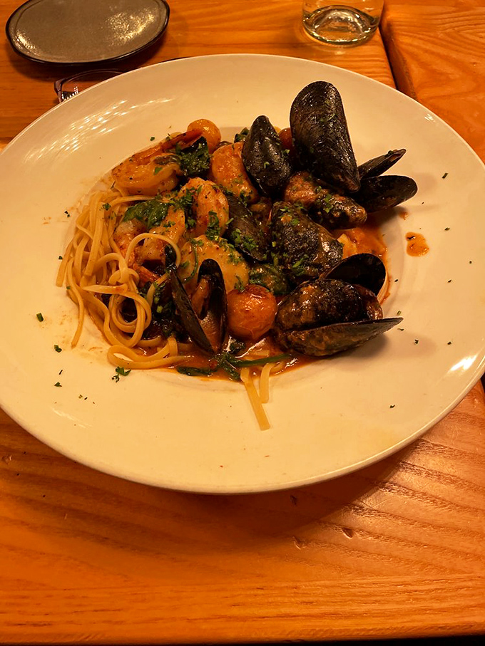 Seafood linguini where mussels and shrimp gather for what appears to be the most delicious underwater reunion imaginable.